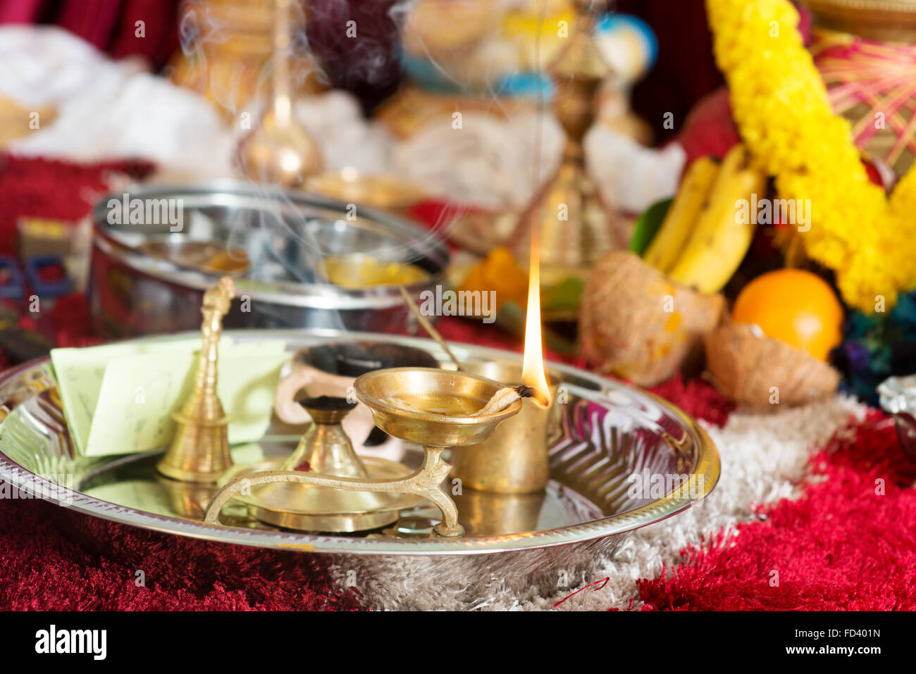 Traditional Indian Hindu religious praying items in ear piercing ...