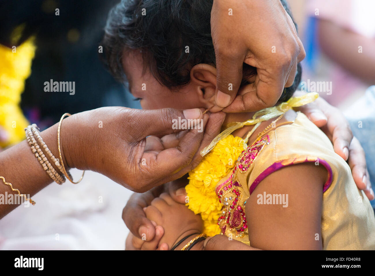 Baby girl crying in the karnavedha events. Traditional Indian Hindus ...