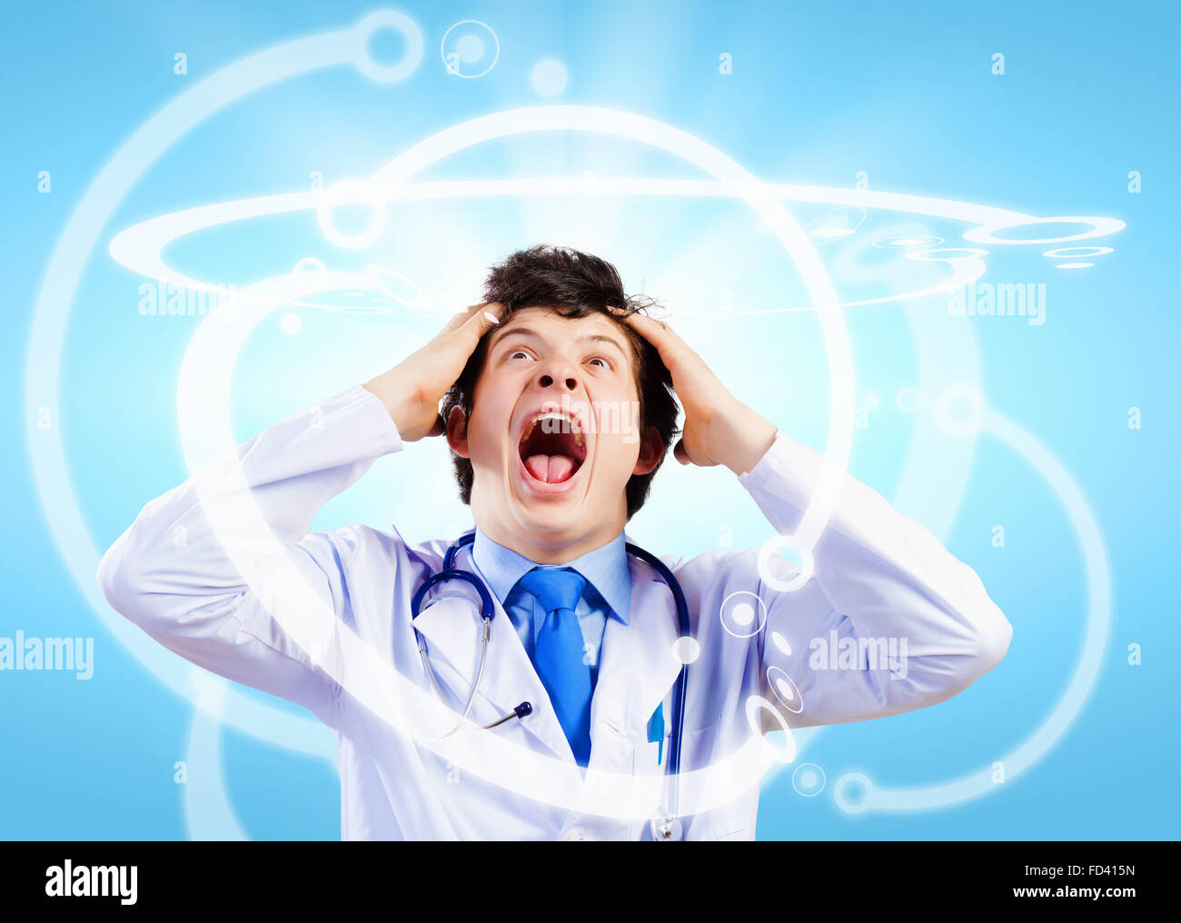 Image of young male doctor screaming in madness Stock Photo - Alamy