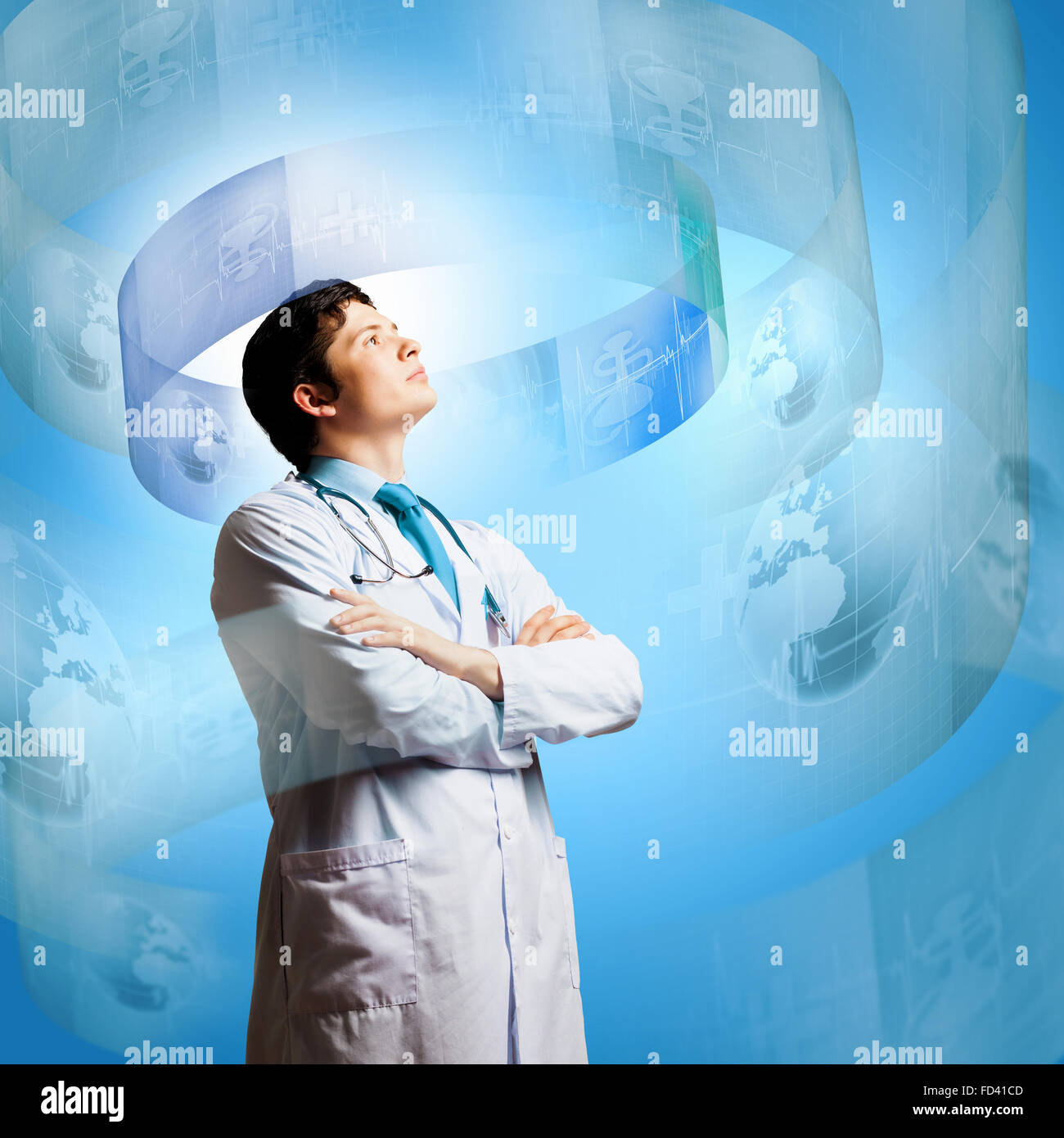 Image of young thoughtful doctor looking at media screen Stock Photo ...