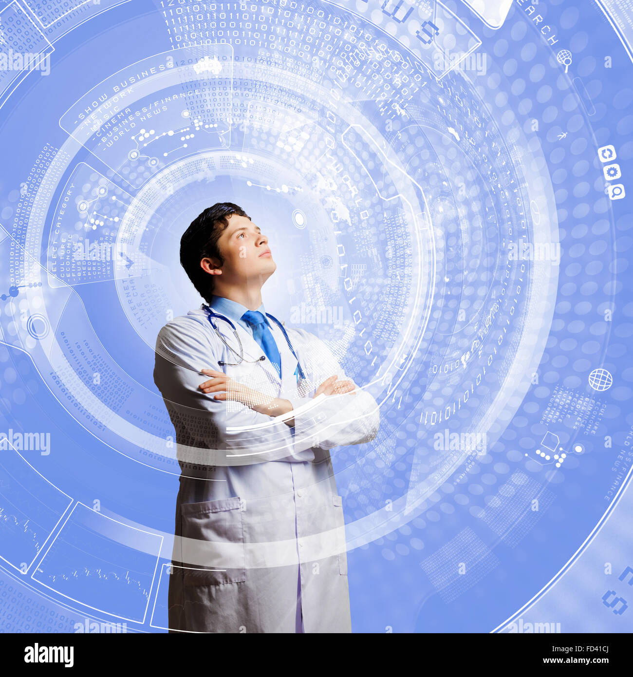 Image of young thoughtful doctor looking at media screen Stock Photo ...