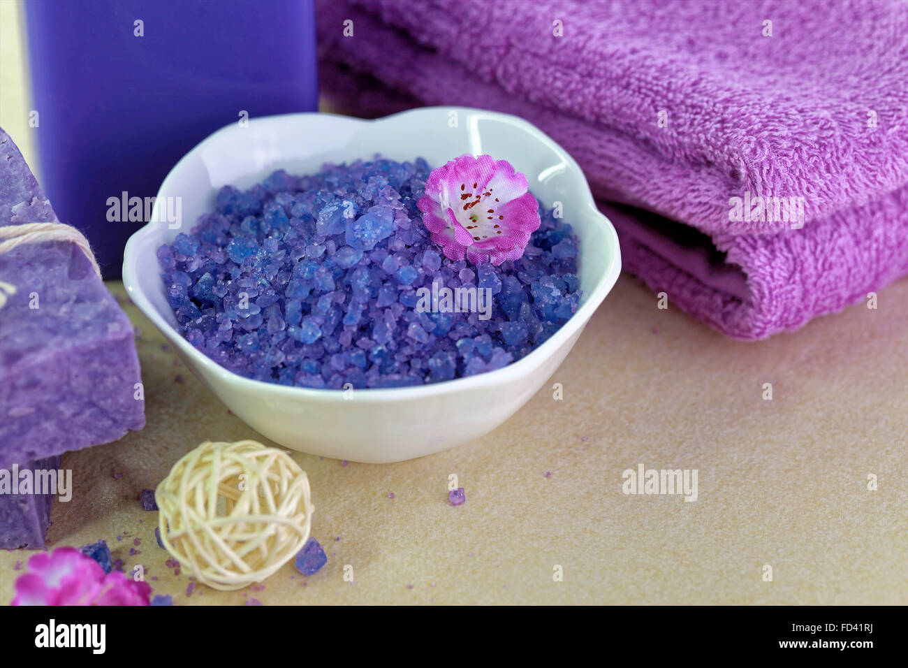 Spa treatment setting with purple theme Stock Photo - Alamy