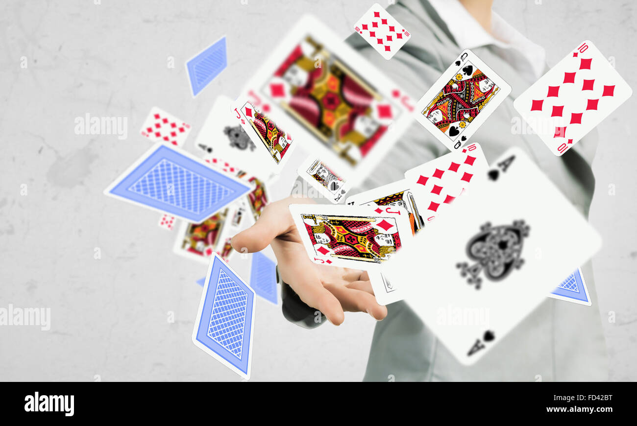 Close-up image of businesswoman throwing card deck Stock Photo - Alamy