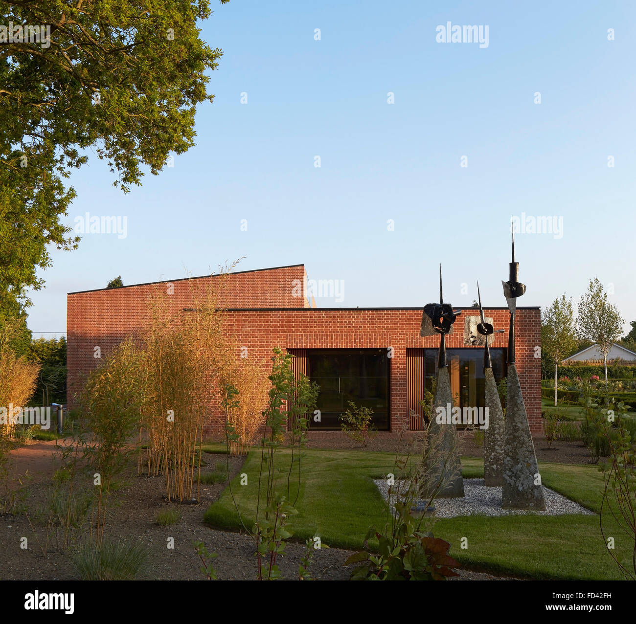 Brick facade with deep window reveals across garden. Britten-Pears ...