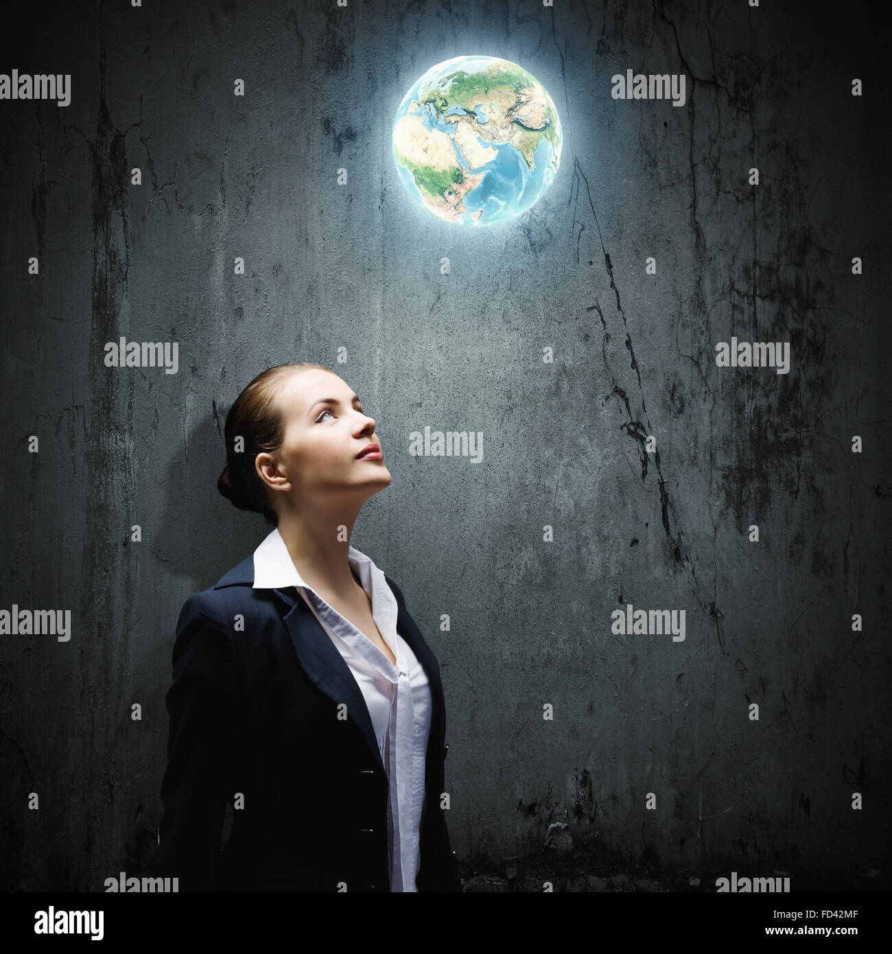 Image of thoughtful businesswoman looking at planet earth Stock Photo ...