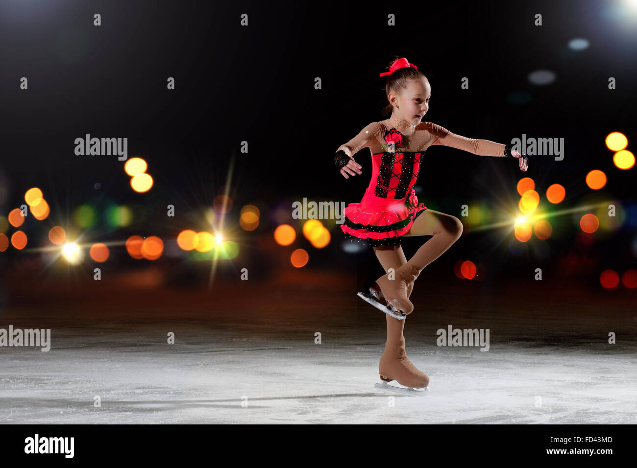 Little girl figure skating at sports arena Stock Photo - Alamy