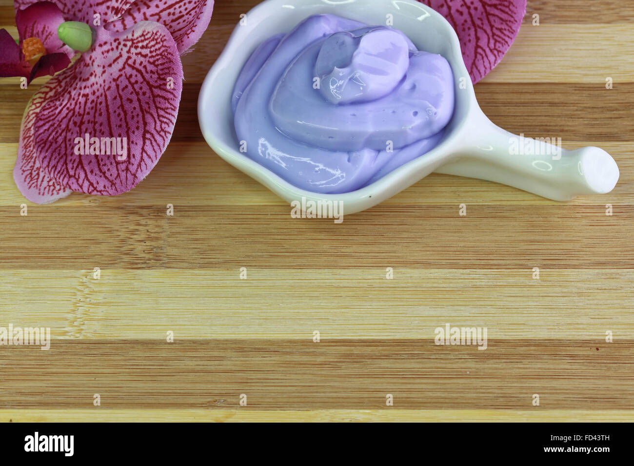 Spa treatment setting with purple theme Stock Photo - Alamy