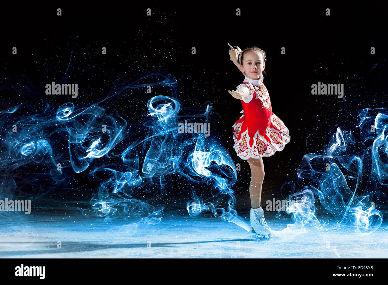 Little girl figure skating at sports arena Stock Photo - Alamy