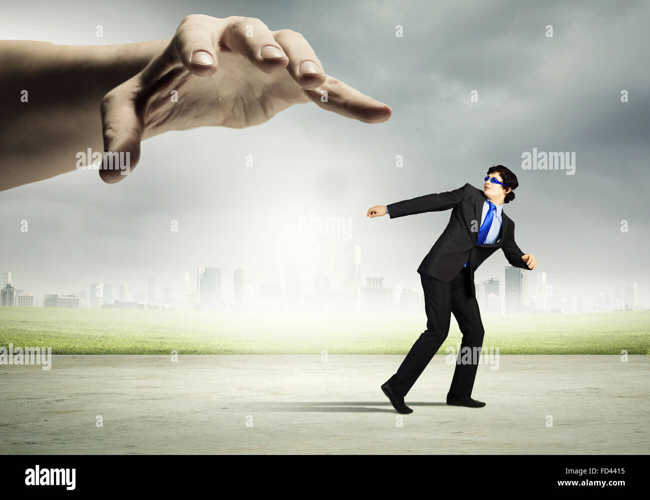 funny image of businessman trying to run away from hand Stock Photo - Alamy