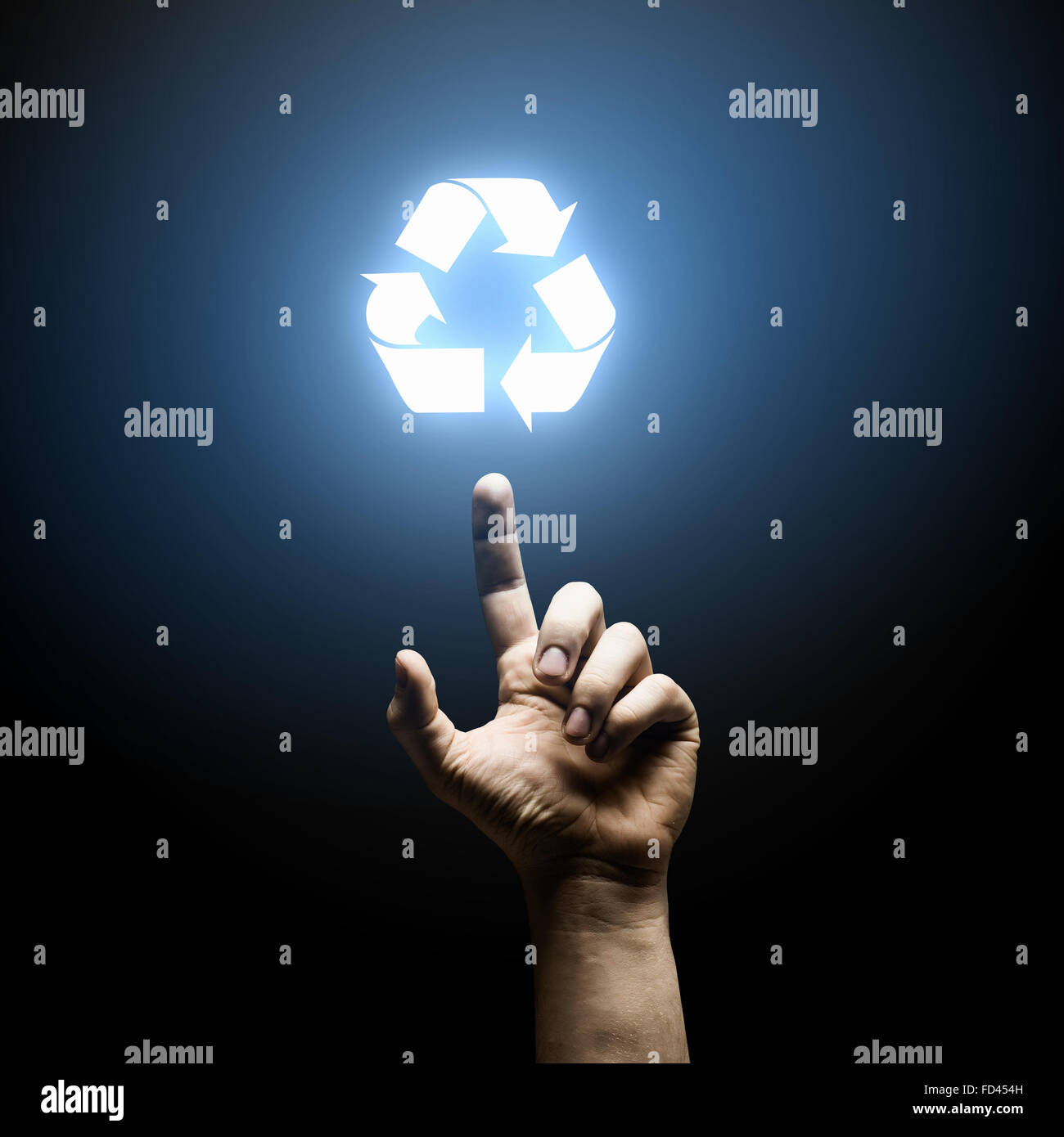 Human hand pointing with finger at recycle symbol Stock Photo - Alamy