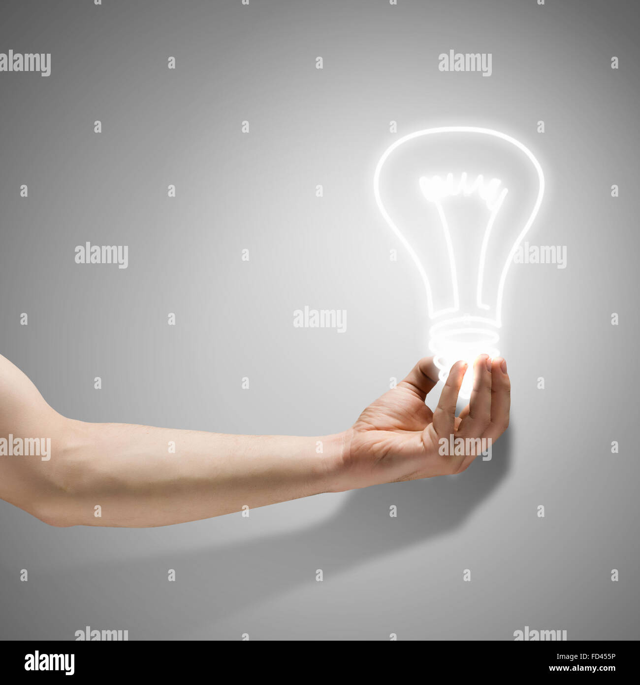 Close up image of human hand holding electrical bulb Stock Photo - Alamy