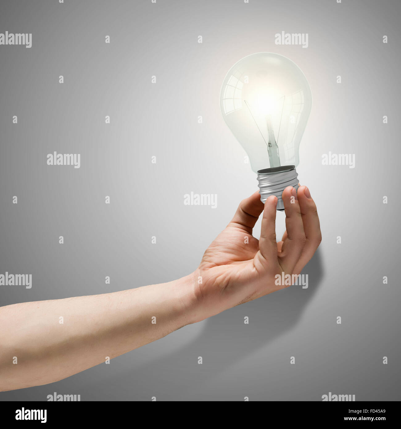 Close up image of human hand holding electrical bulb Stock Photo - Alamy