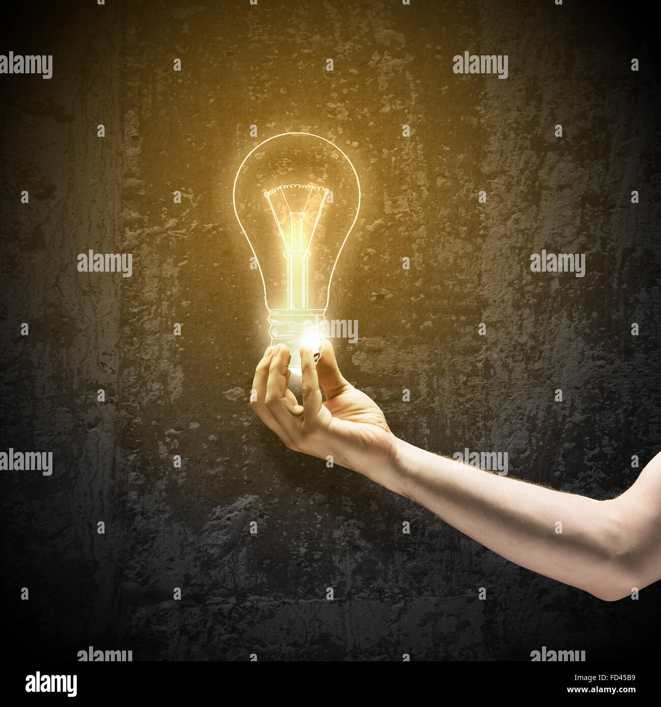 Close up image of human hand holding electrical bulb in darkness Stock ...