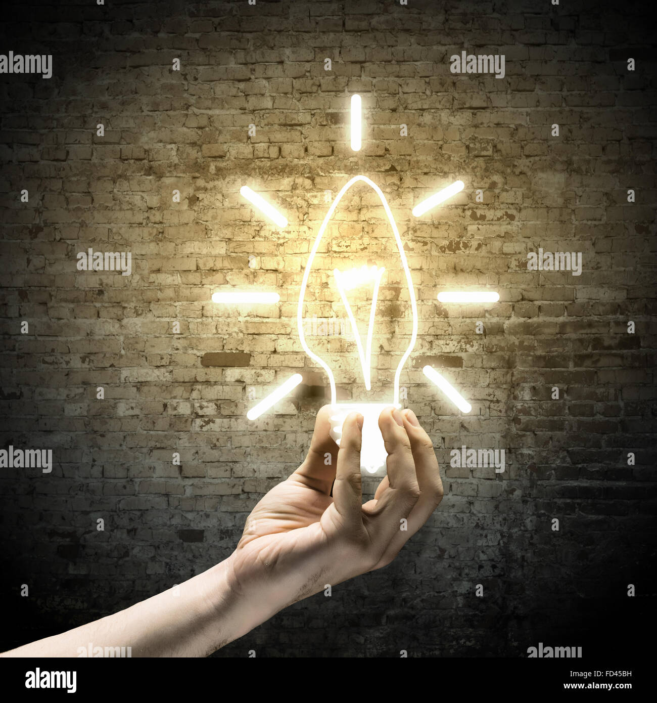Close up image of human hand holding electrical bulb in darkness Stock ...
