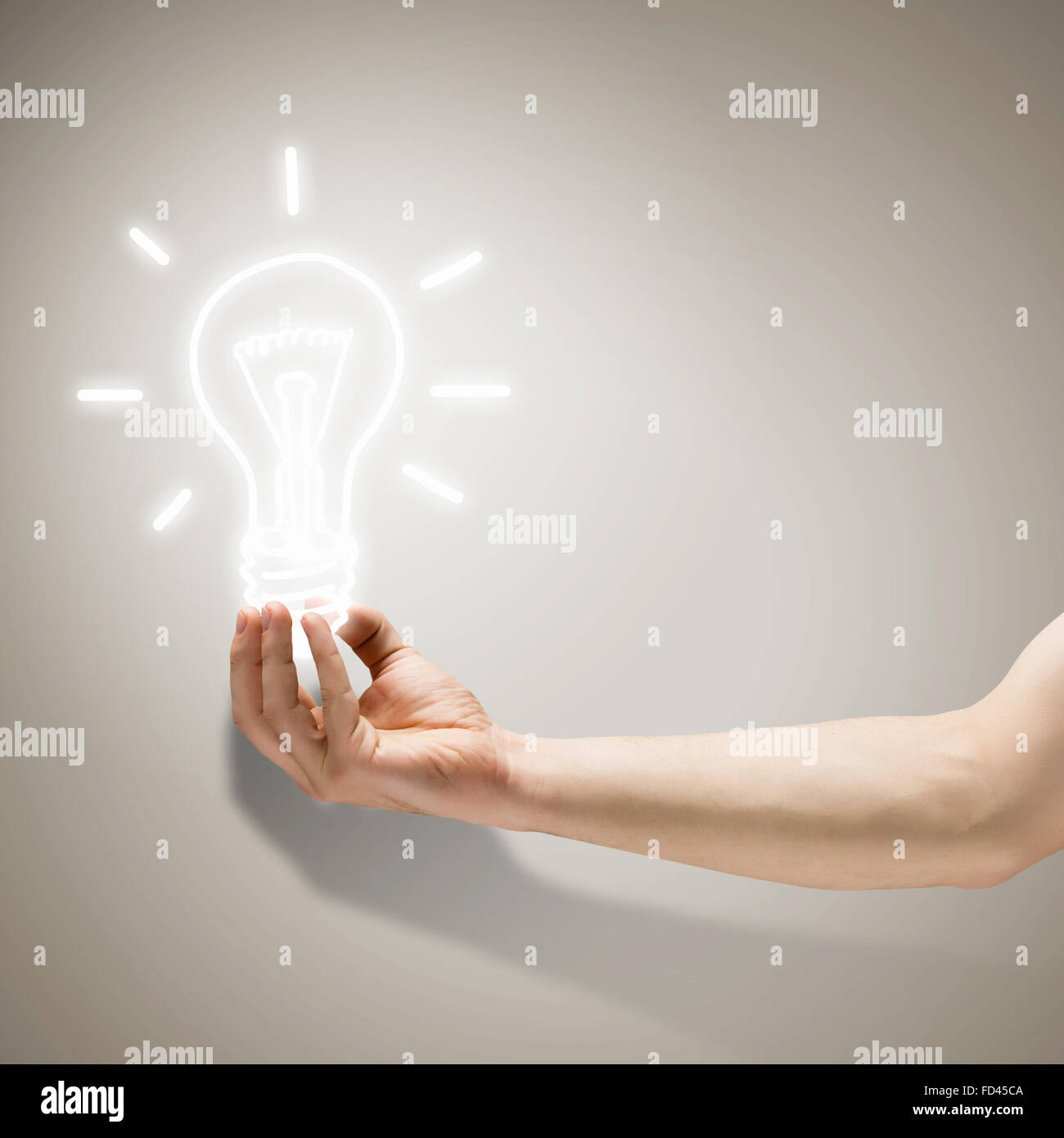 Close up image of human hand holding electrical bulb Stock Photo - Alamy