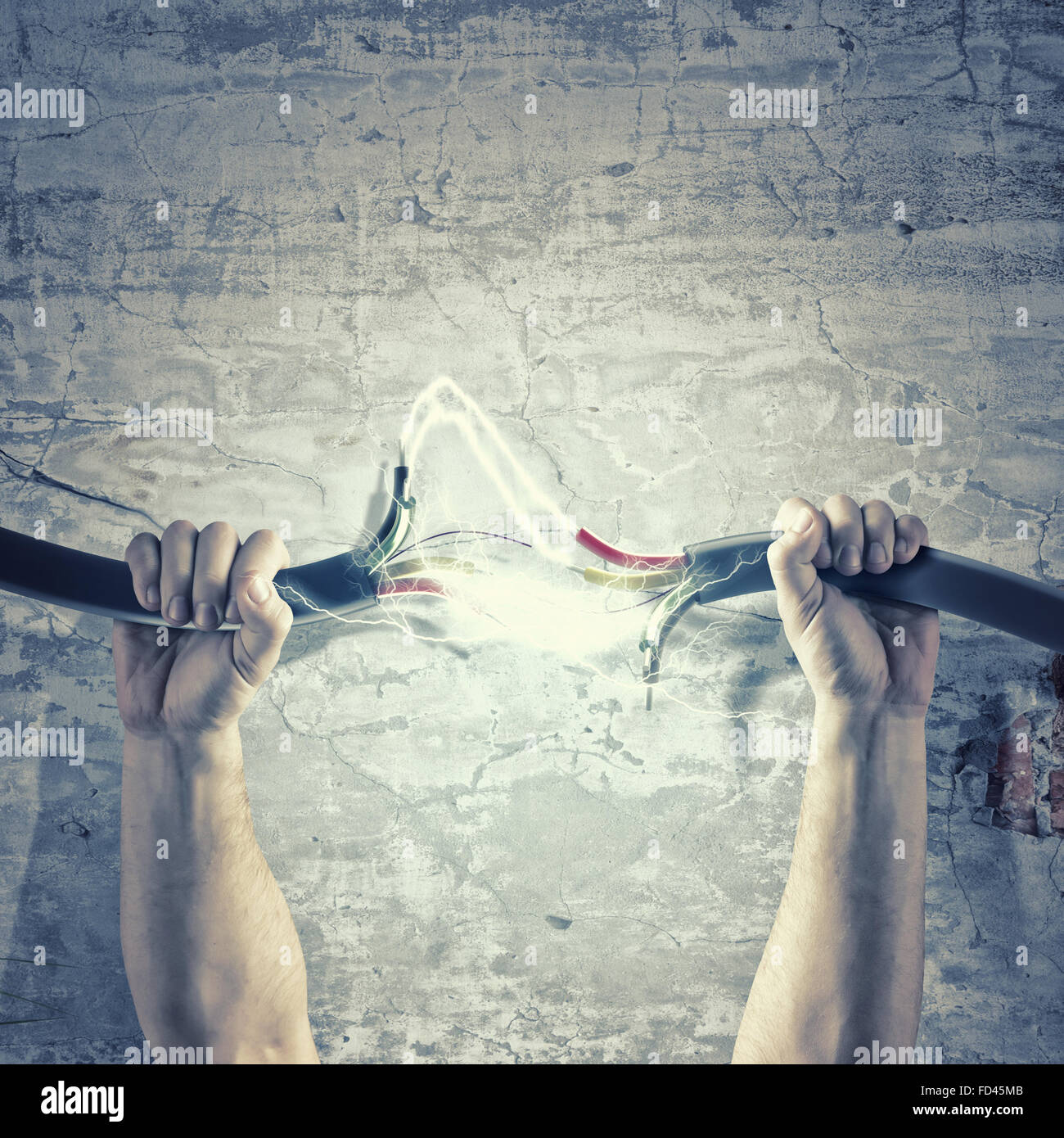 Cable in human hand. Power and connection Stock Photo - Alamy