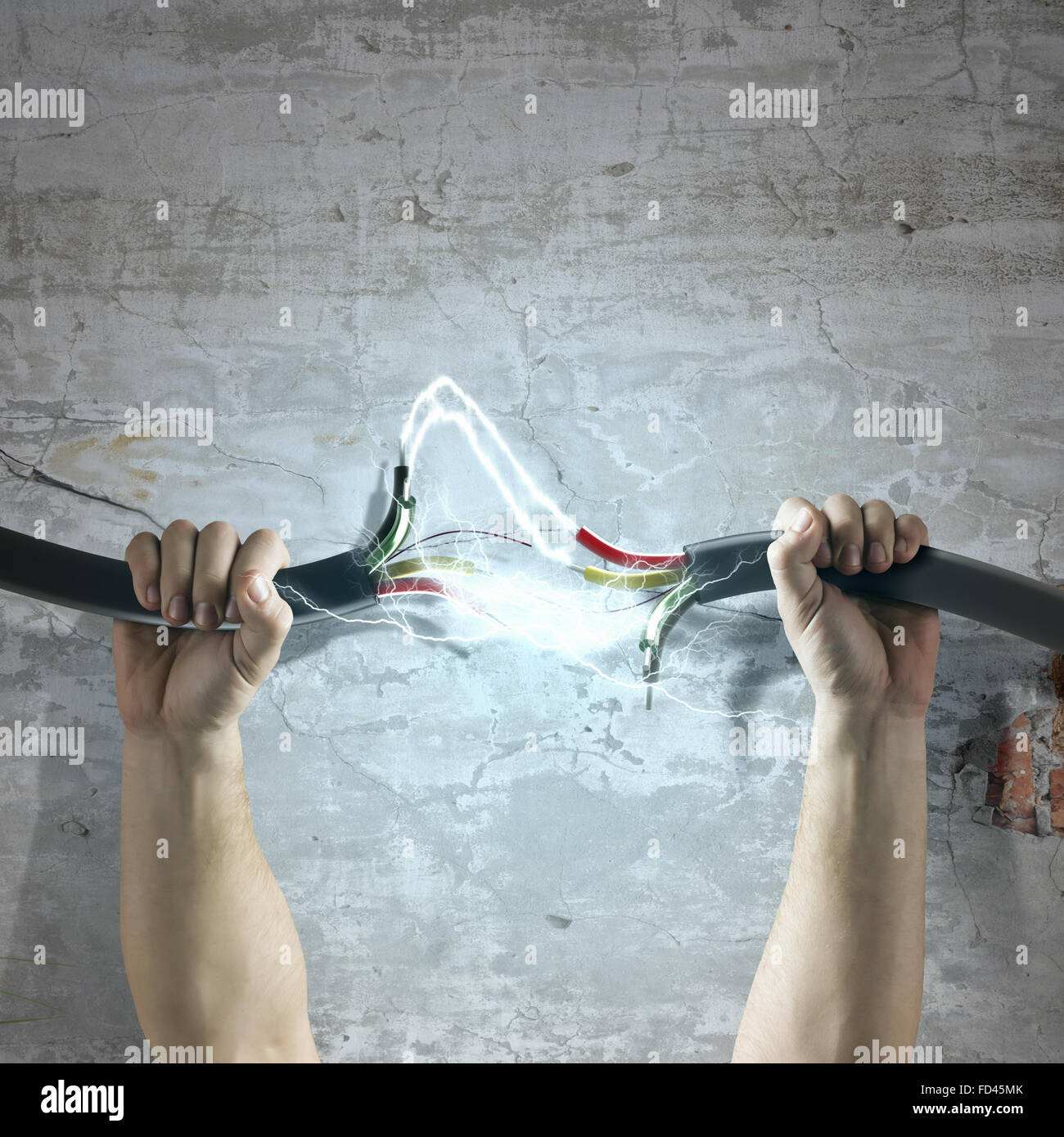 Cable in human hand. Power and connection Stock Photo - Alamy