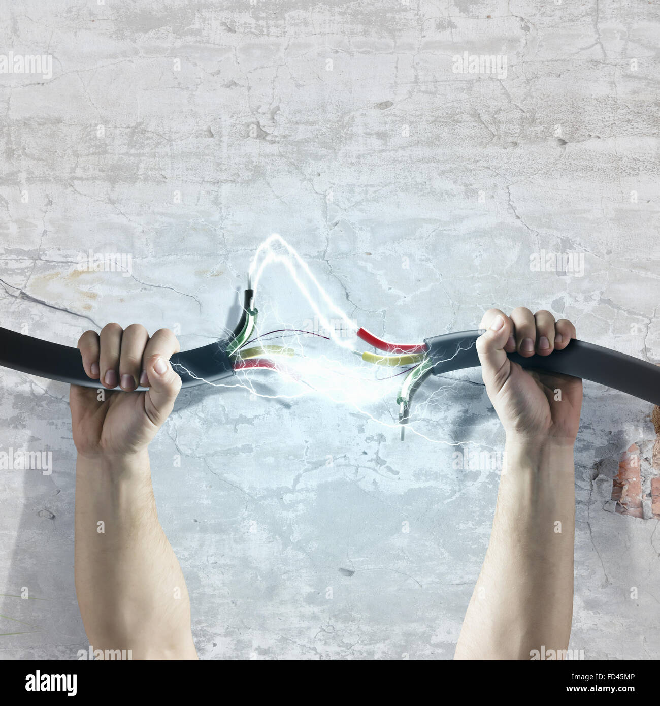 Cable in human hand. Power and connection Stock Photo - Alamy
