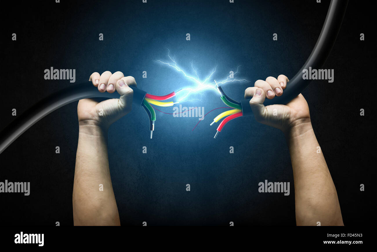 Cable in human hand. Power and connection Stock Photo - Alamy