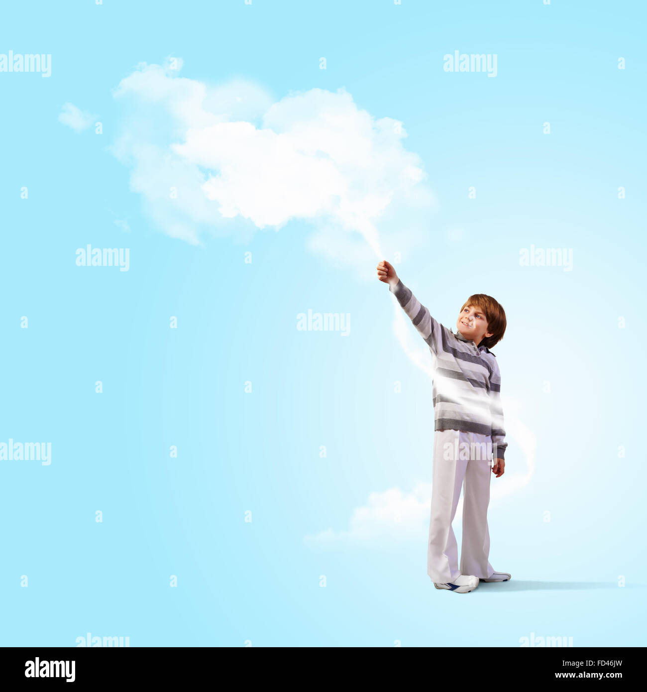 Image of little cute boy catching clouds in sky Stock Photo - Alamy