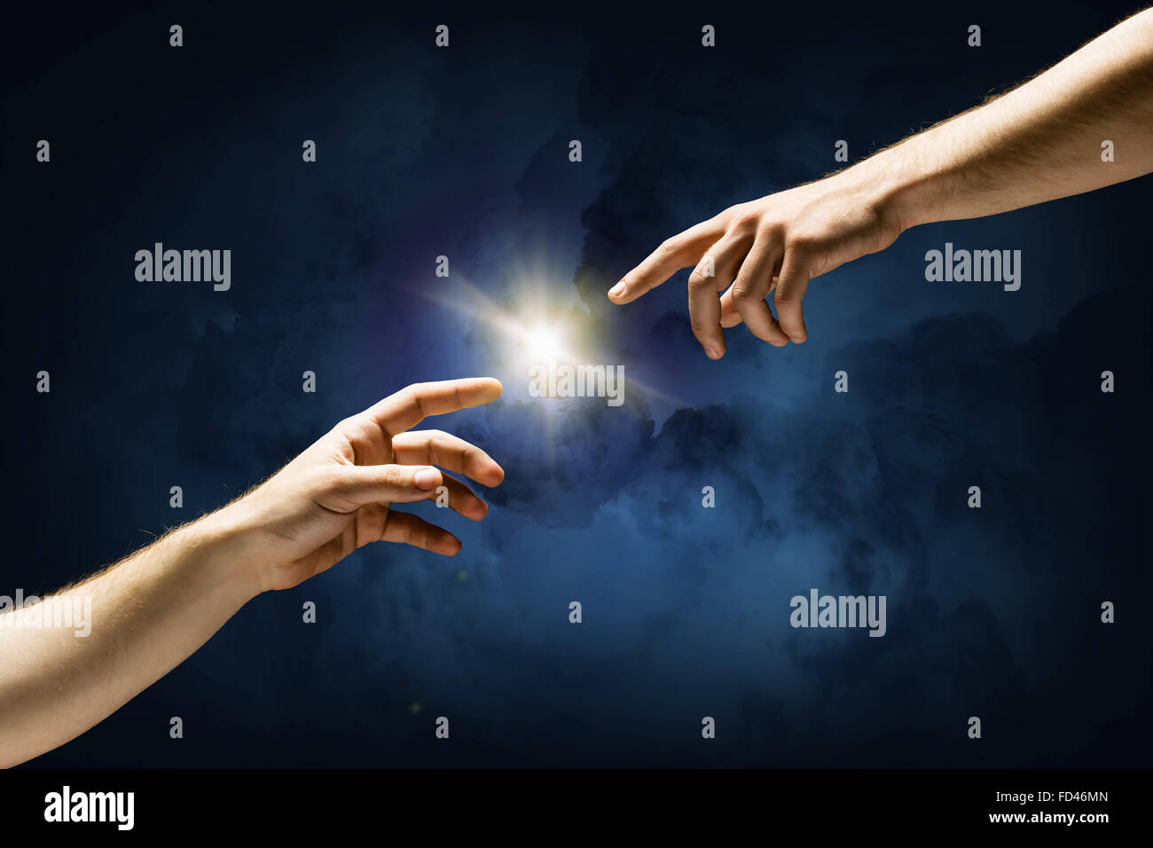 Michelangelo God's touch. Close up of human hands touching with fingers ...