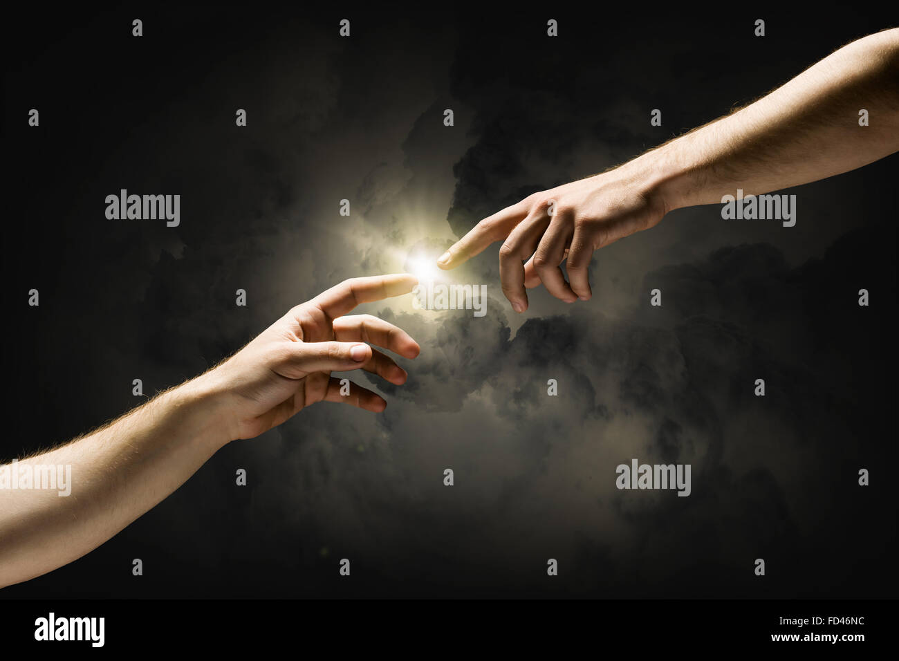 Michelangelo God's touch. Close up of human hands touching with fingers ...