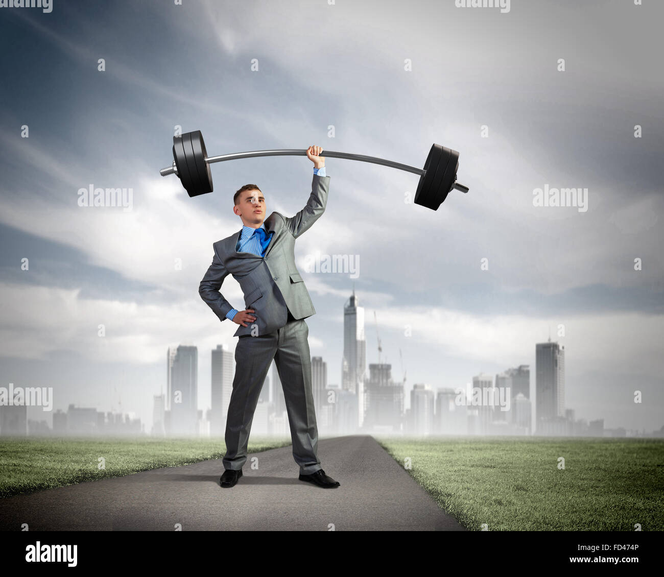 Image of strong businessman lifting barbell above head with one hand ...