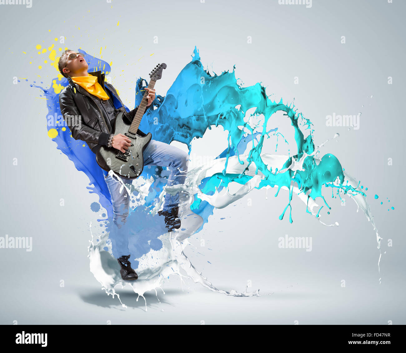 Young man, rock musician in jacket playing guitar Stock Photo - Alamy