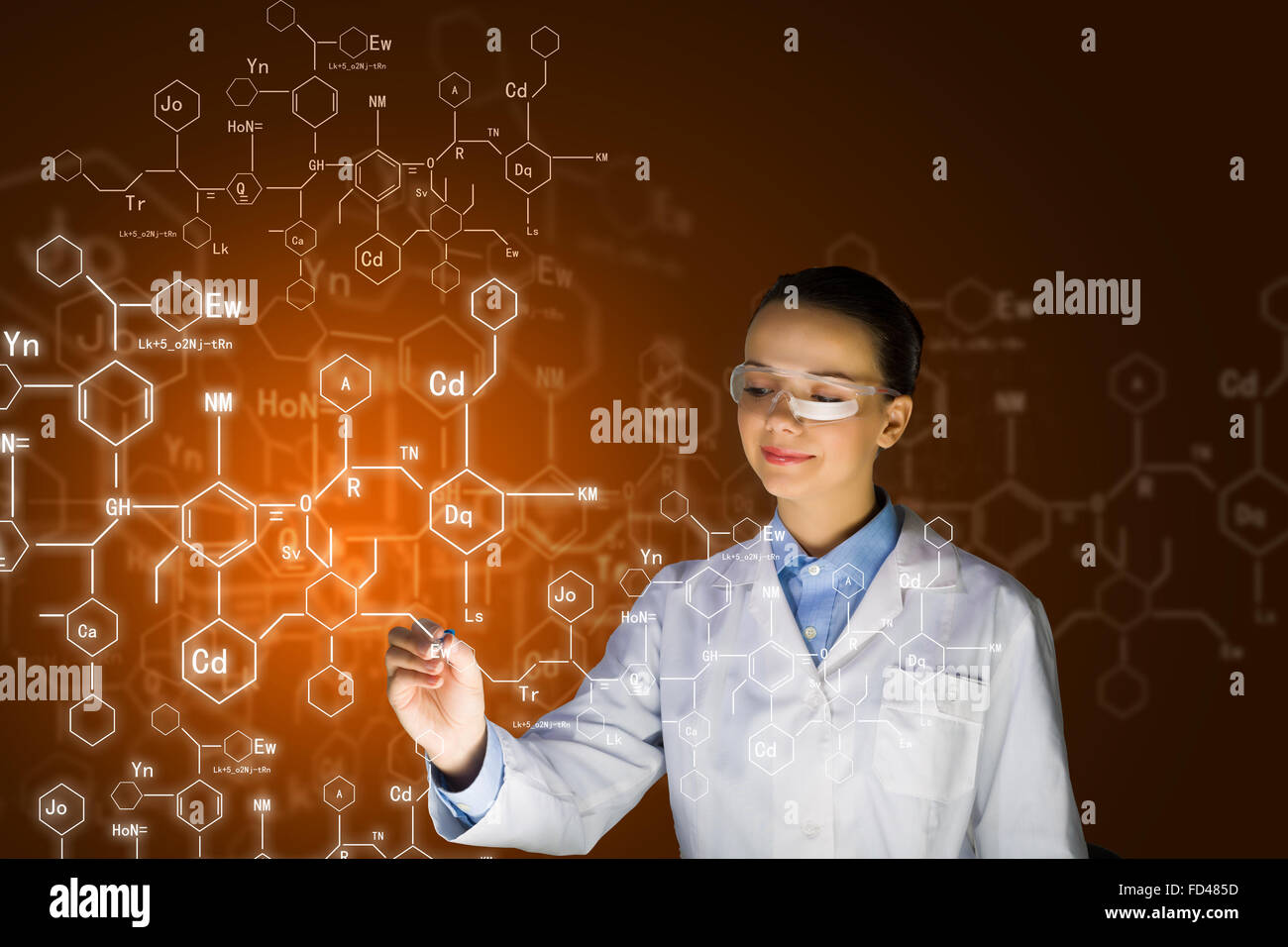 Young woman researcher in medical uniform drawing chemistry formulas ...
