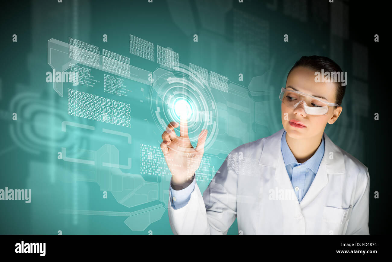 Image of young woman scientist touching icon of media screen Stock ...