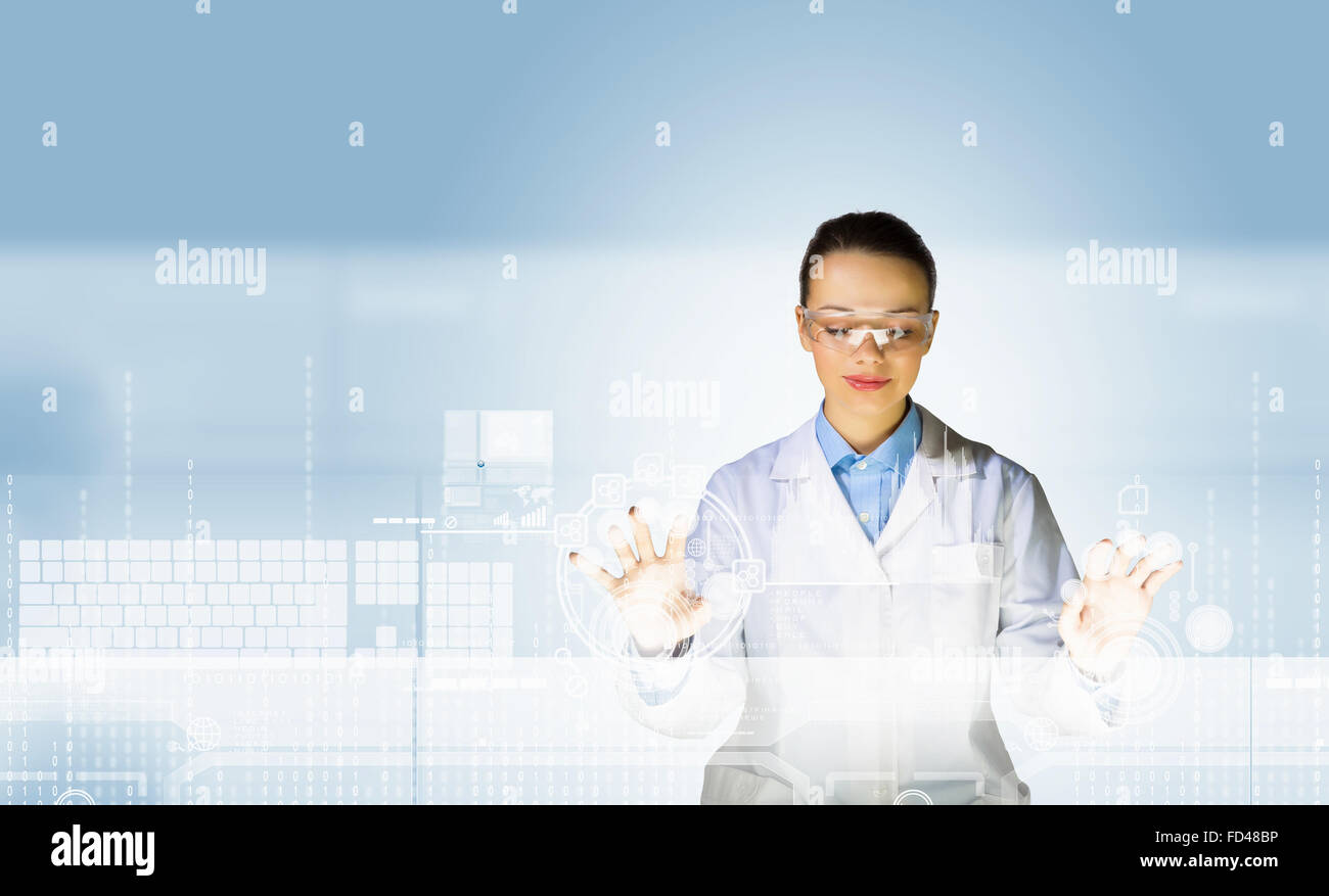 Image of young woman scientist touching icon of media screen Stock ...