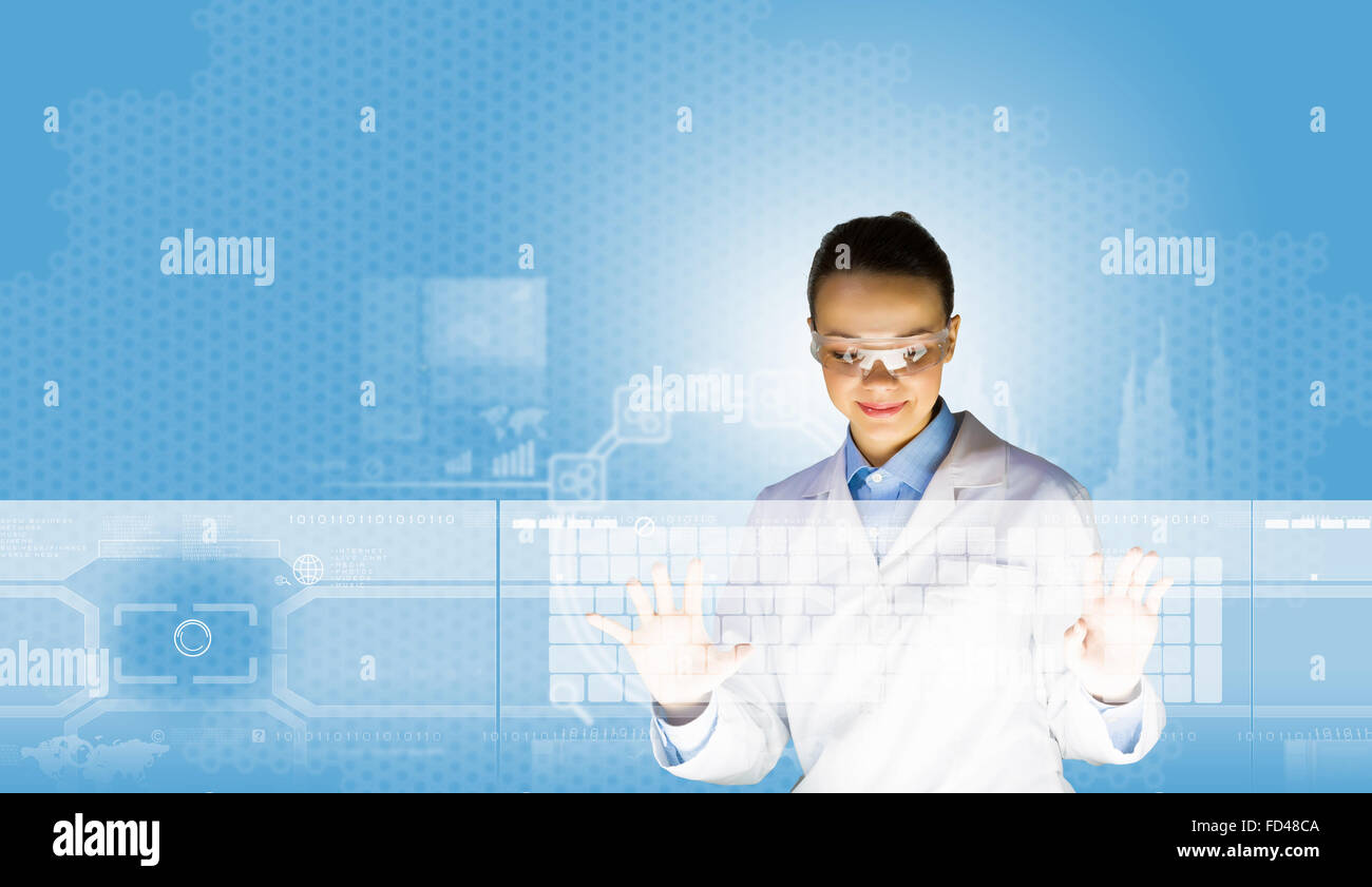 Image of young woman scientist touching icon of media screen Stock ...