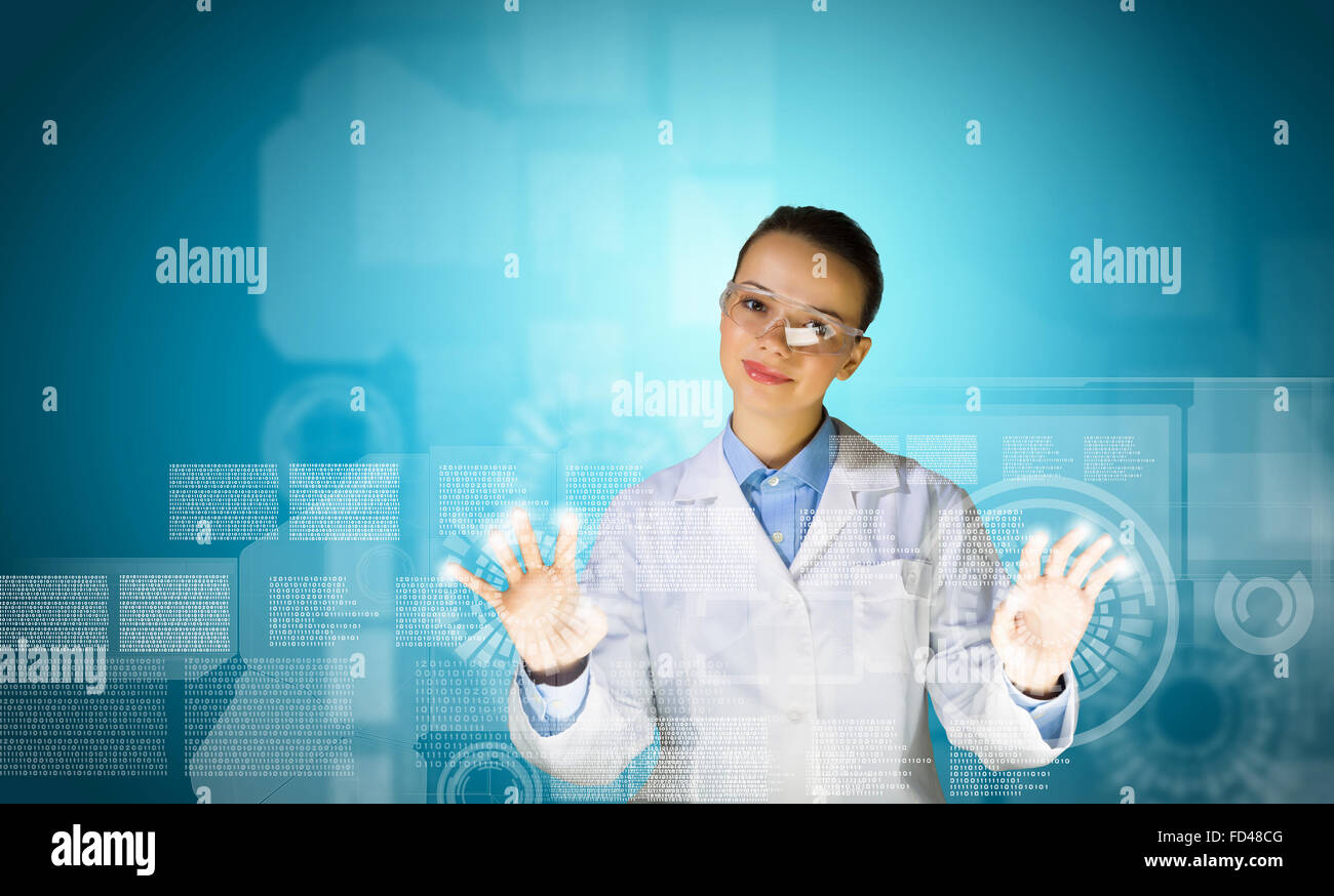 Image of young woman scientist touching icon of media screen Stock ...