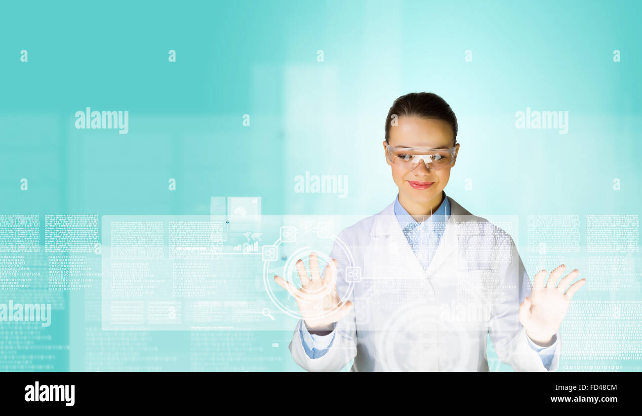 Image of young woman scientist touching icon of media screen Stock ...