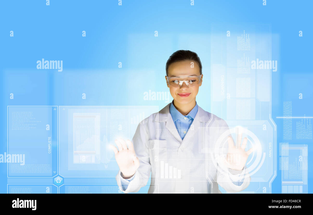 Image of young woman scientist touching icon of media screen Stock ...