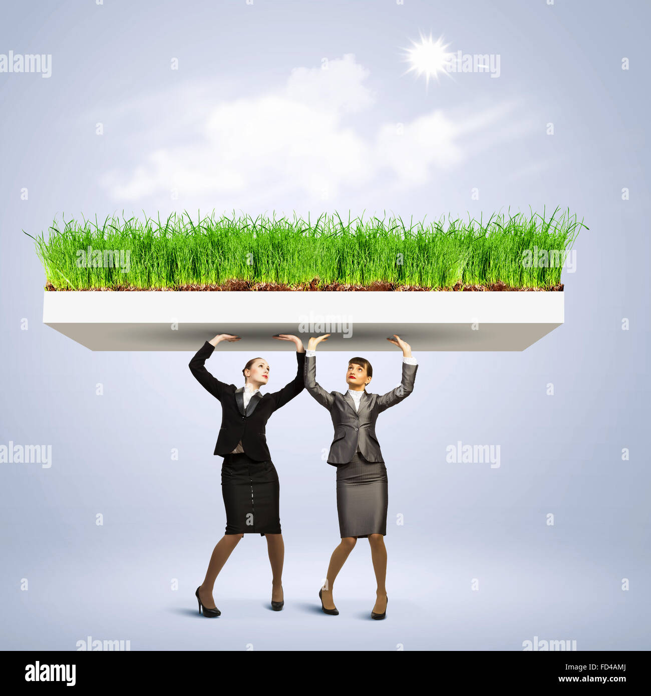 Image of two businesswomen holding lawn above head. Partnership and ...