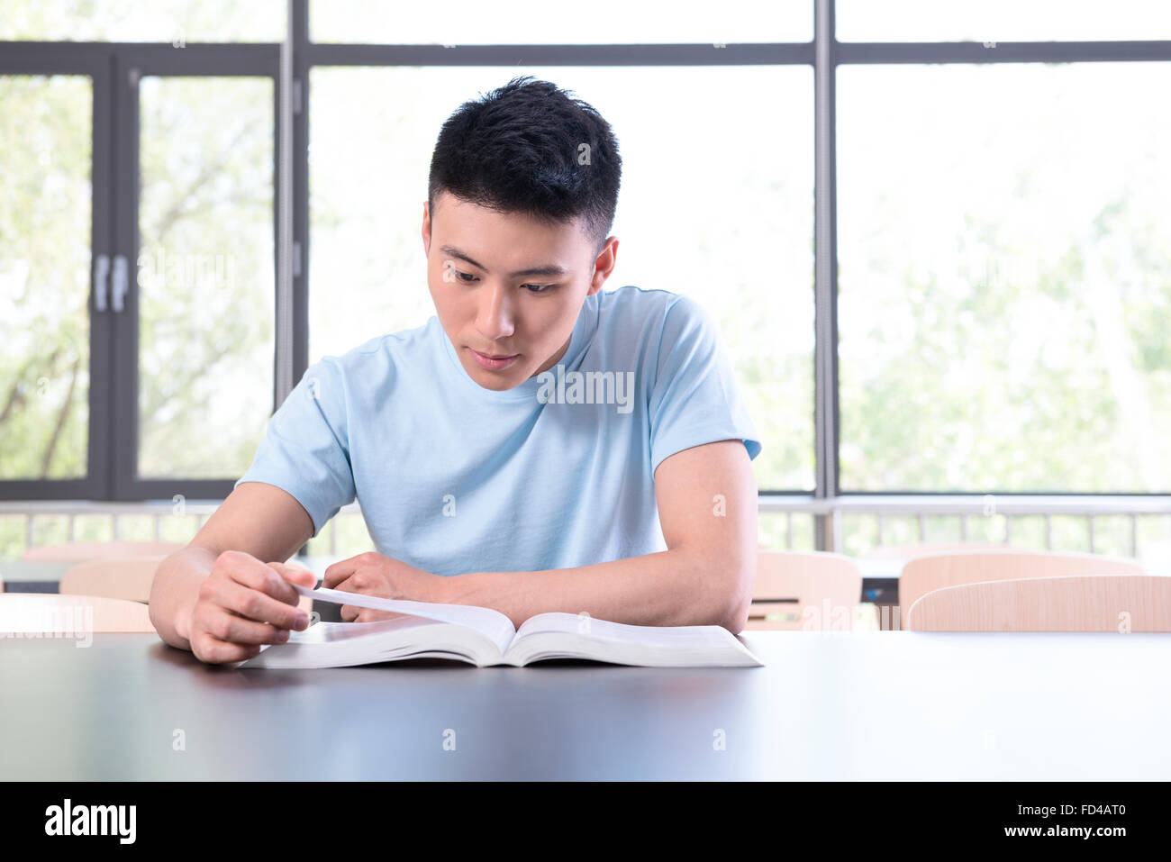 College student studying in library Stock Photo - Alamy