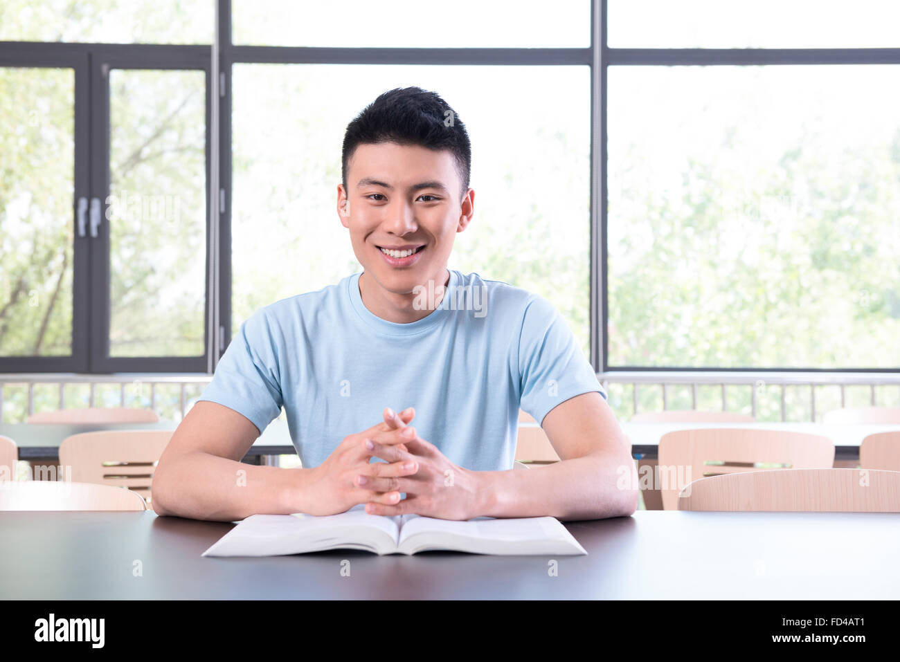 College student studying in library Stock Photo - Alamy