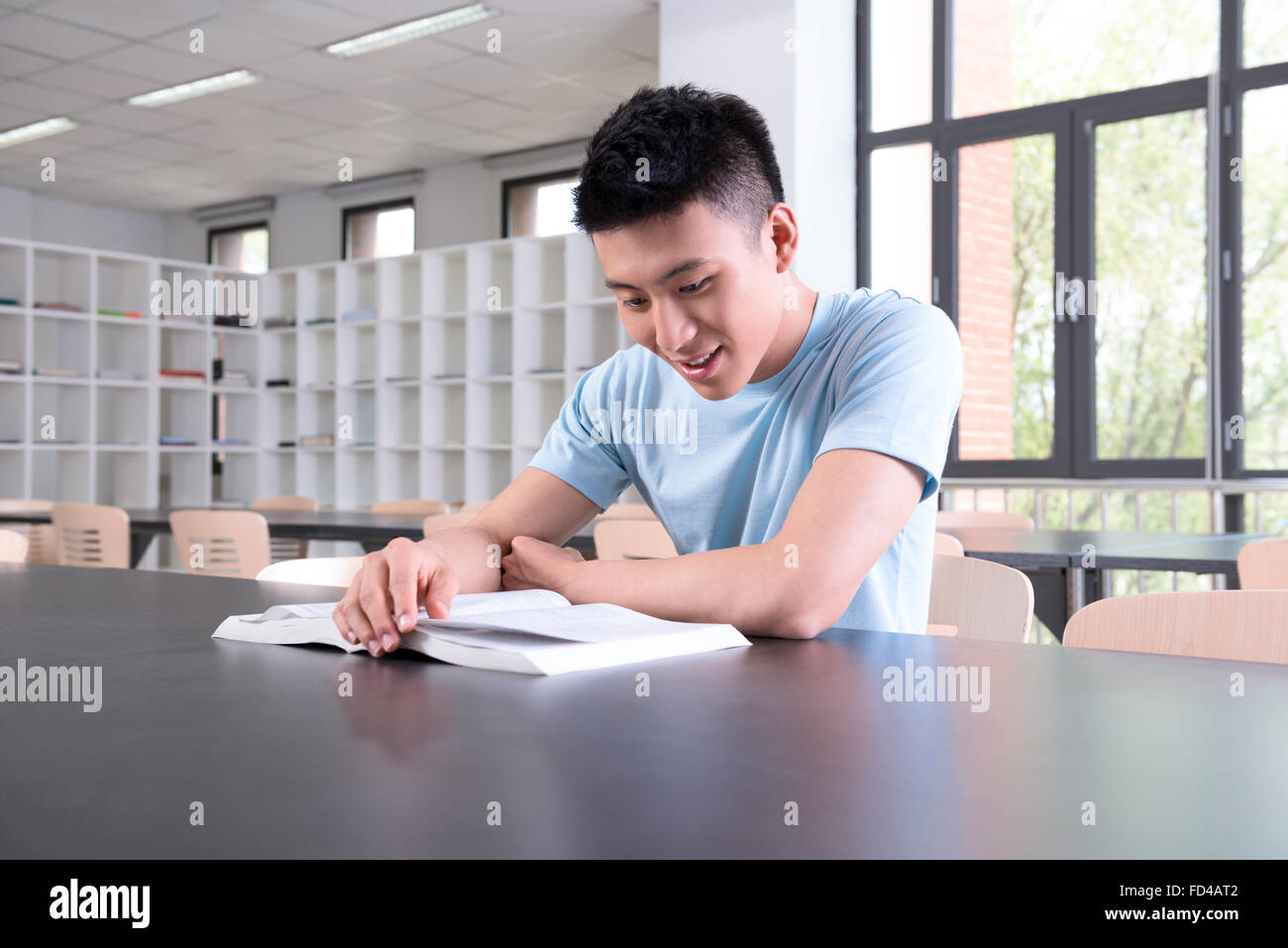 College student studying in library Stock Photo - Alamy