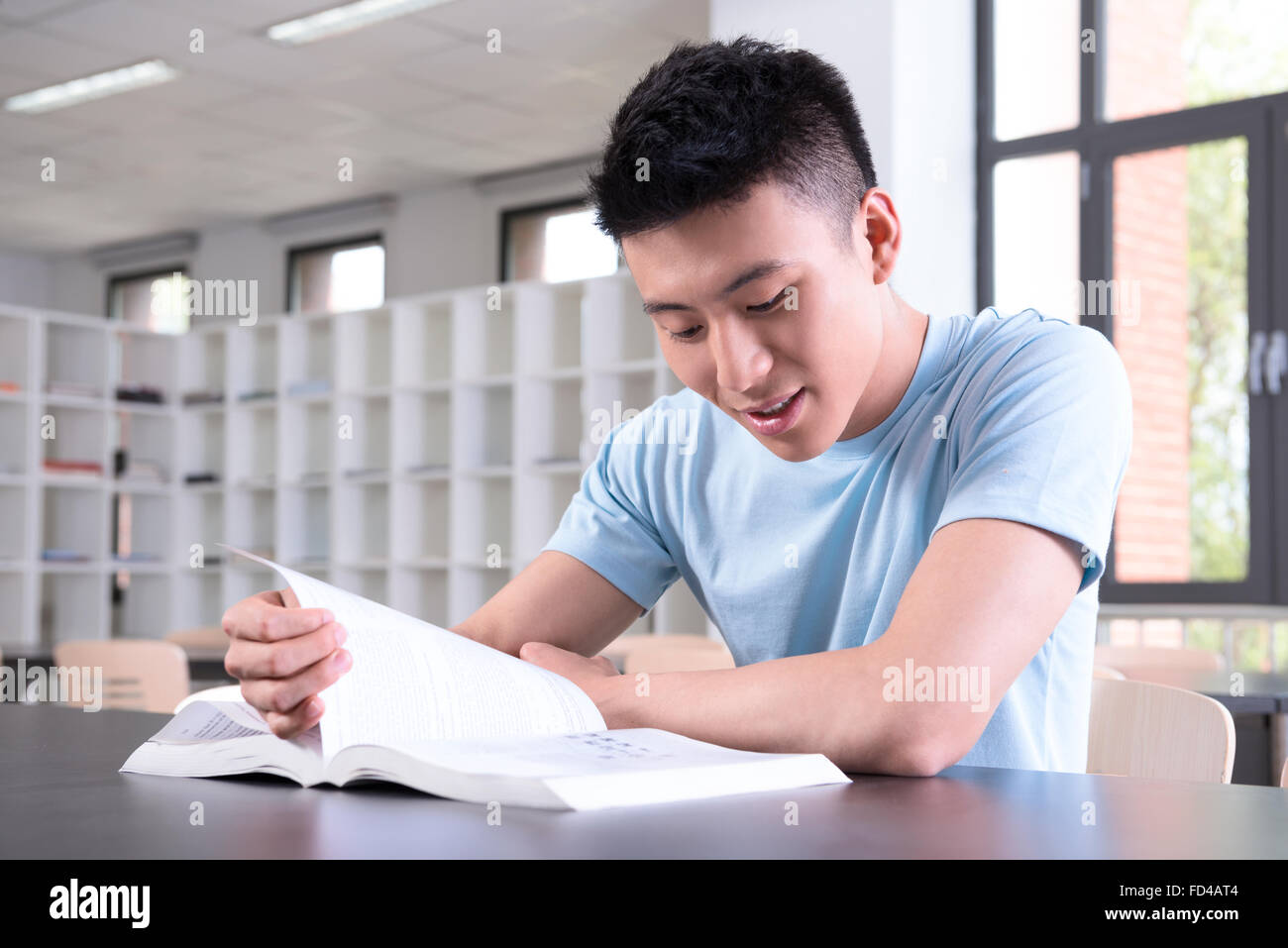 College student studying in library Stock Photo - Alamy
