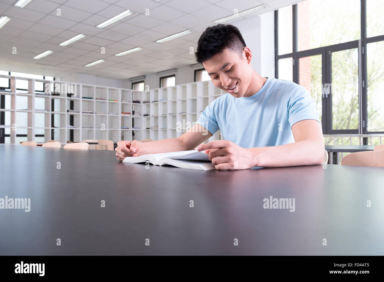 College student studying in library Stock Photo - Alamy