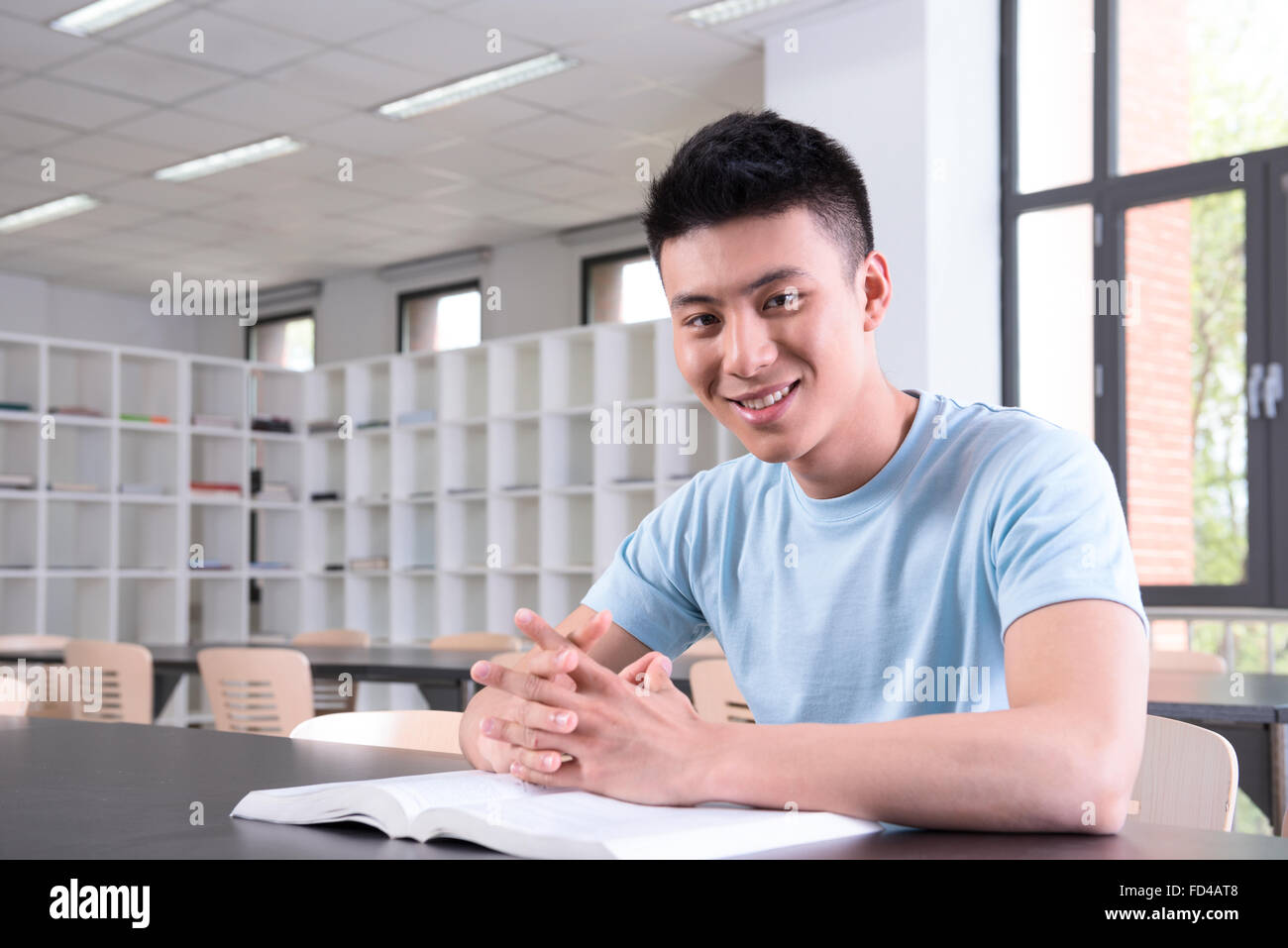 College student studying in library Stock Photo - Alamy