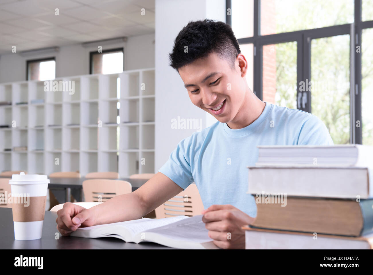 College student studying in library Stock Photo - Alamy