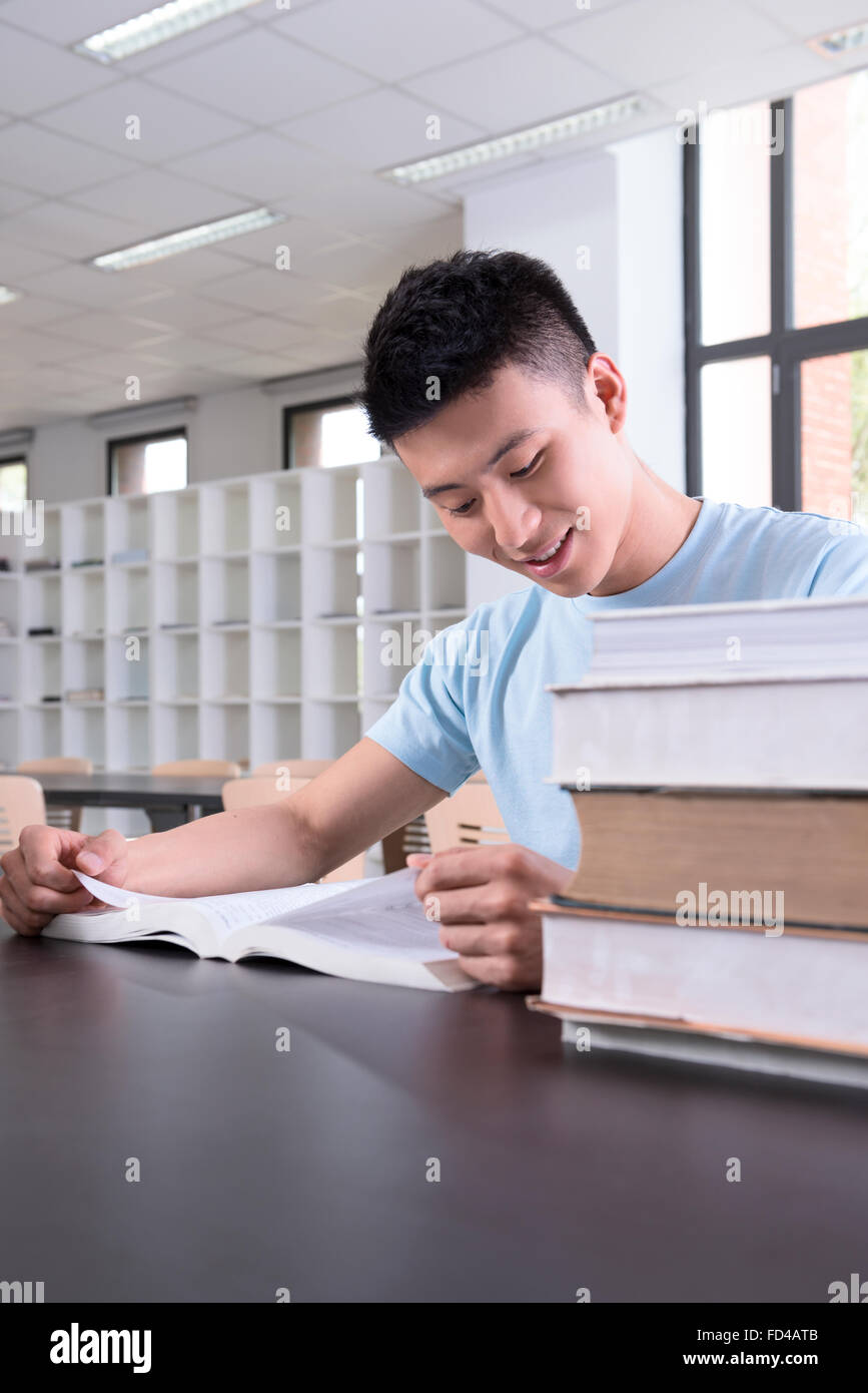 College student studying in library Stock Photo - Alamy