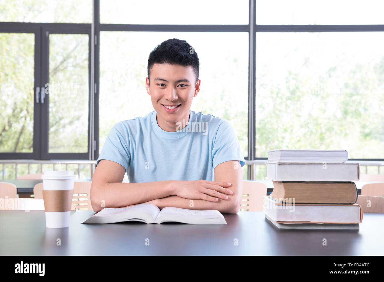 College student studying in library Stock Photo - Alamy