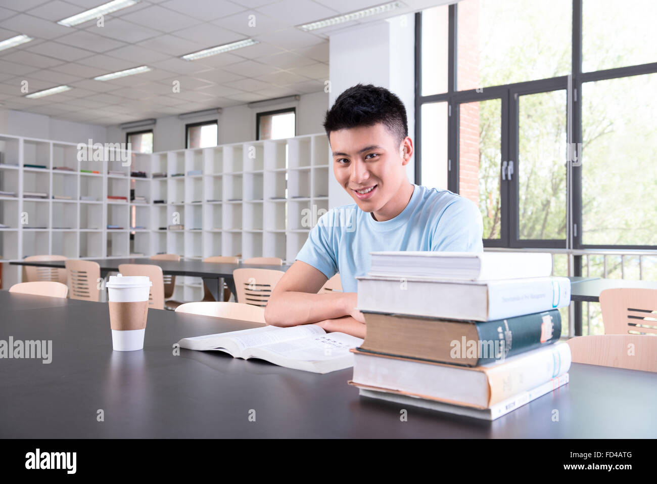 College student studying in library Stock Photo - Alamy