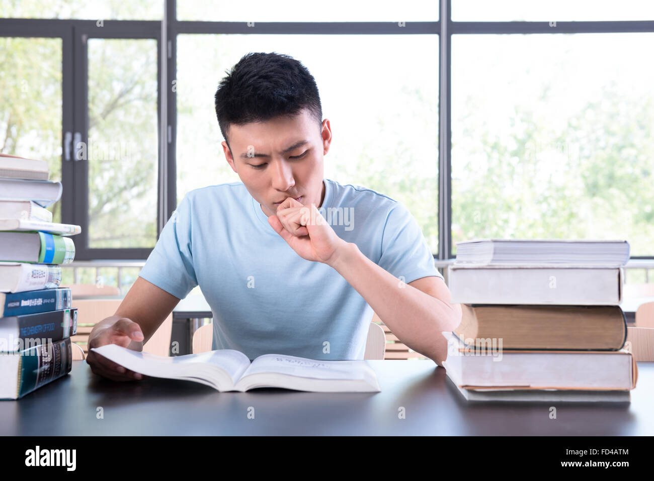 College student studying in library Stock Photo - Alamy