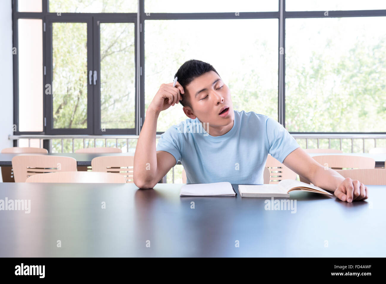 Person falling asleep desk hi-res stock photography and images - Alamy