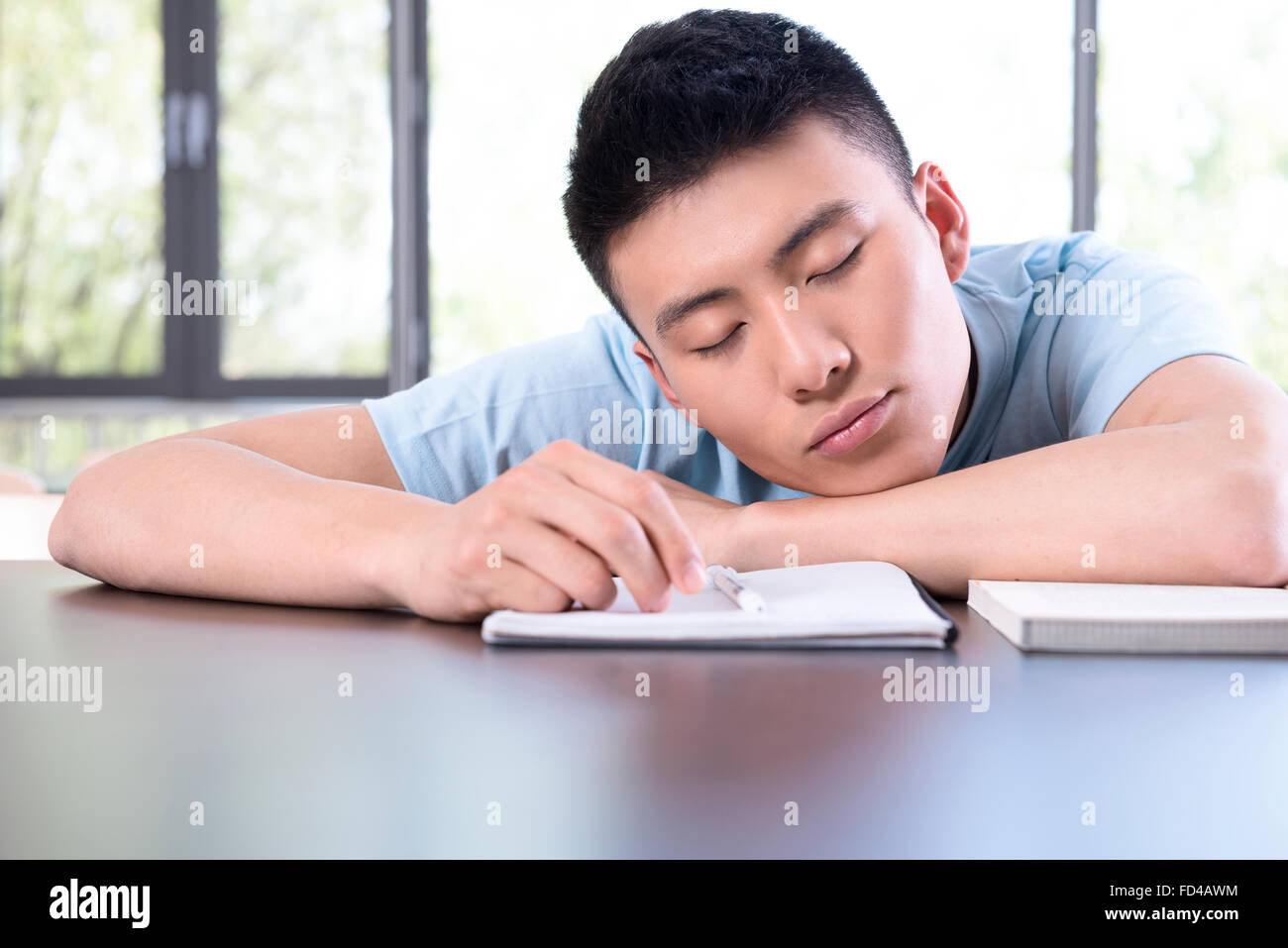 Person falling asleep desk hi-res stock photography and images - Alamy