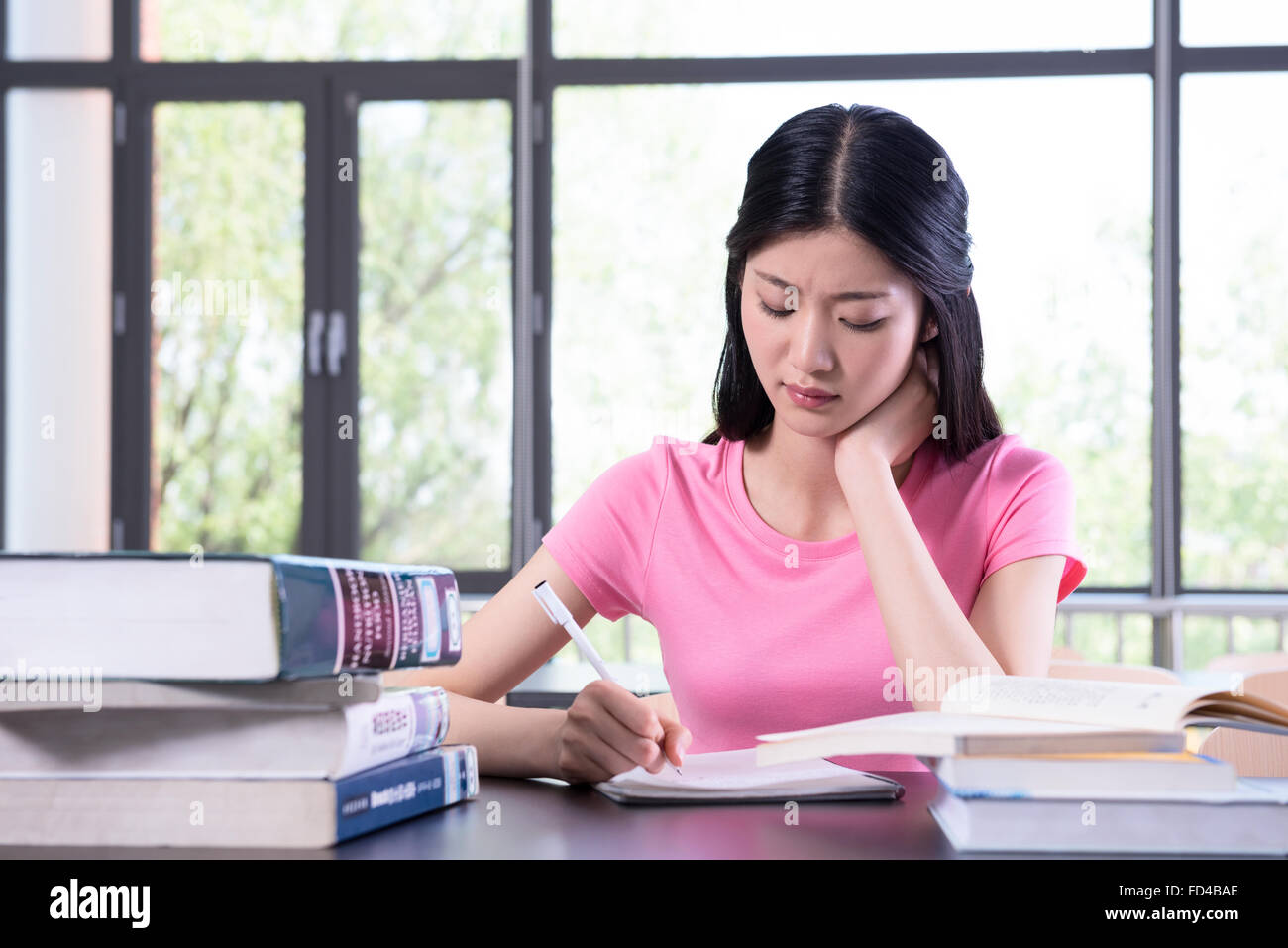 Serious writing student studying hi-res stock photography and images ...